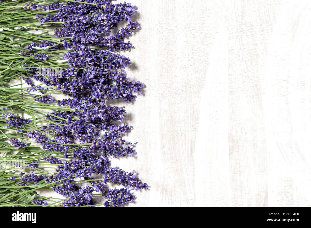 Fresh lavender flowers on bright wooden background Stock Photo - Alamy