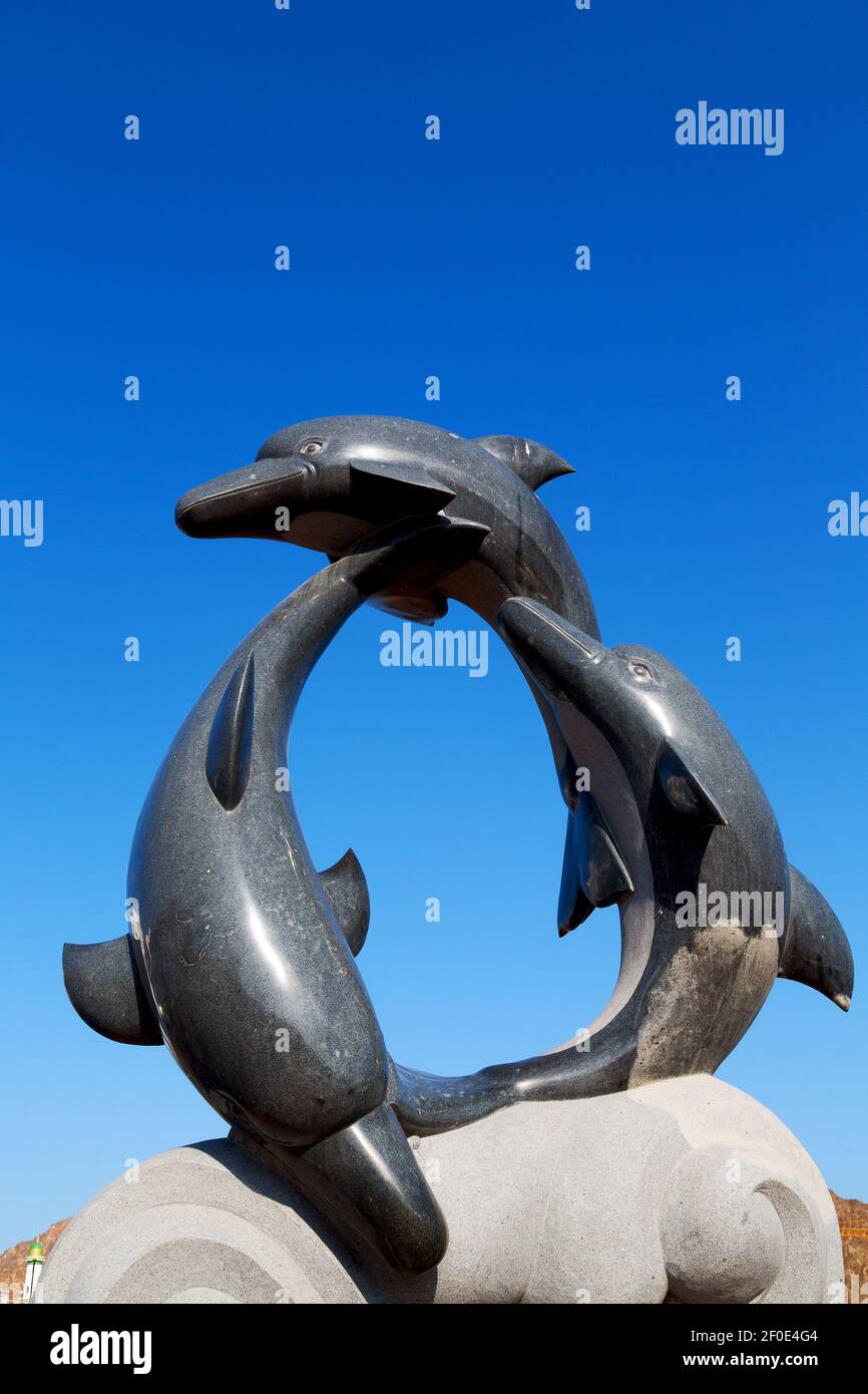 In oman old statue of dolphin Stock Photo - Alamy