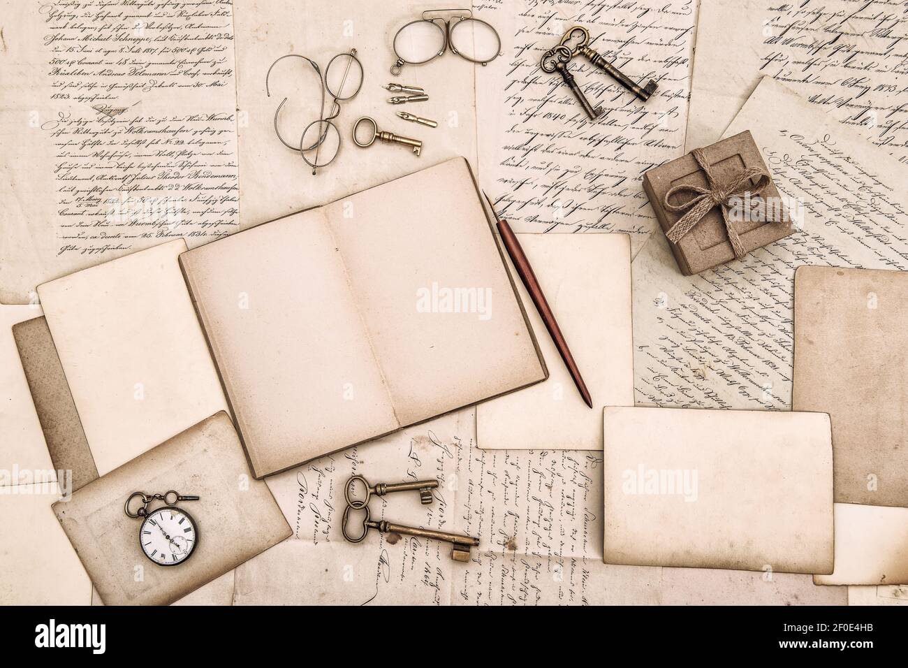 Open book and old handwritten letters. Vintage style flat lay ...
