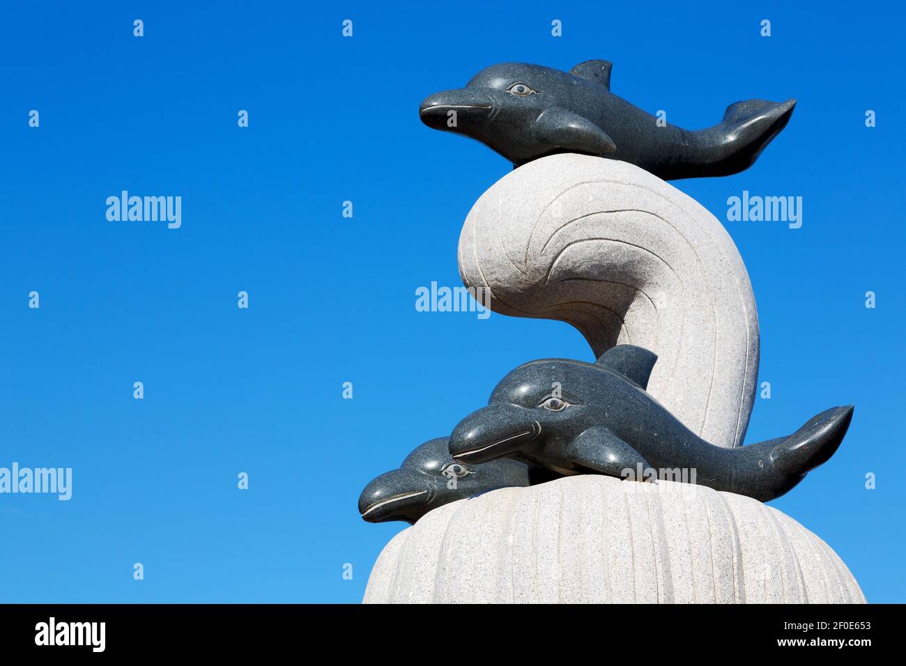 In oman old statue of dolphin Stock Photo - Alamy