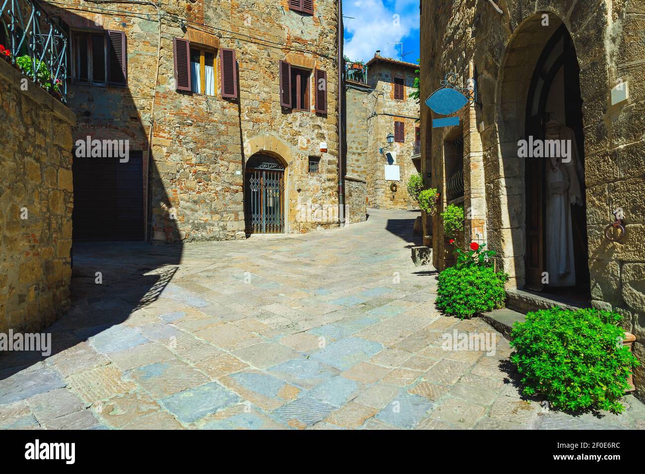 Beautiful tuscan street view. Rustic stone houses and paved street ...