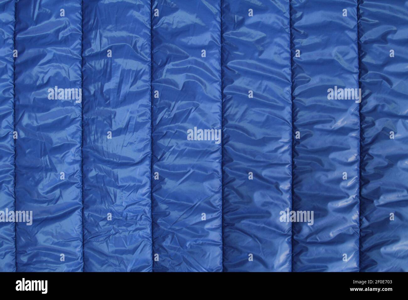 Fashionable quilted fabric in blue color Stock Photo - Alamy