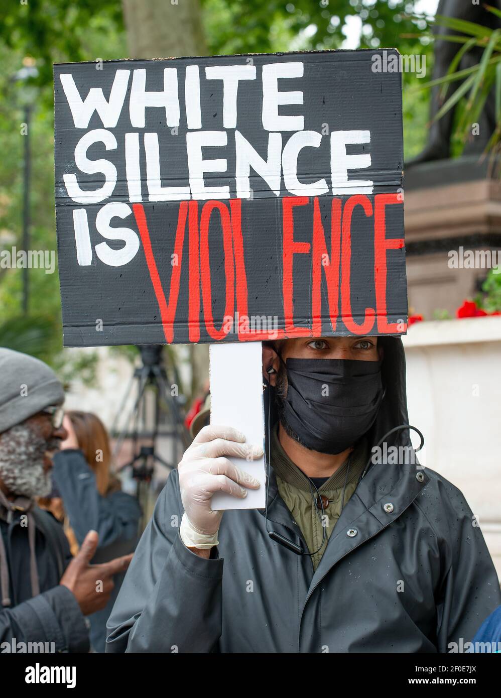 Anti-racism campaigner holding sign, at the Black Lives Matter ...