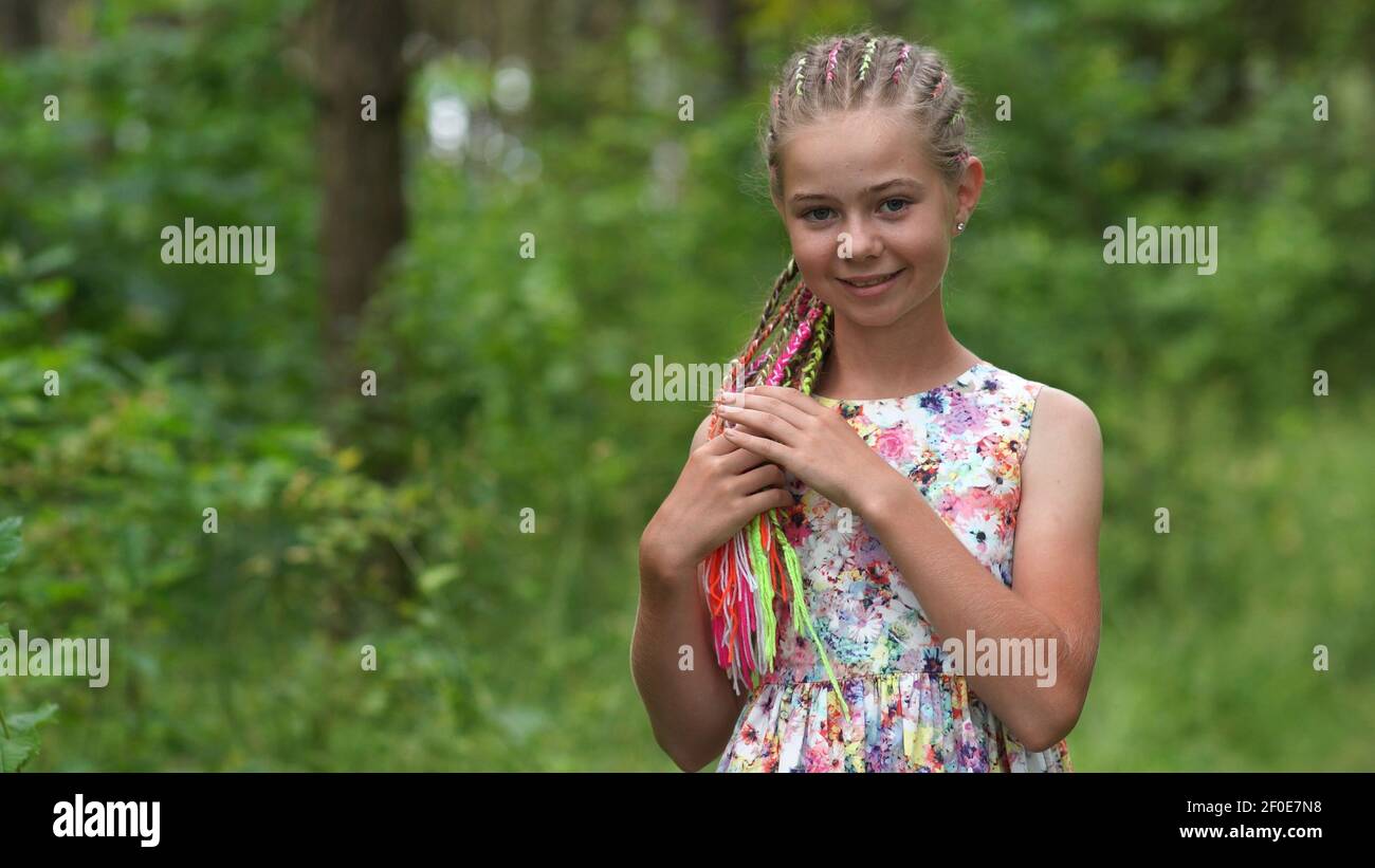 Teenage girl with multi-colored dreadlocks in the forest Stock Photo ...