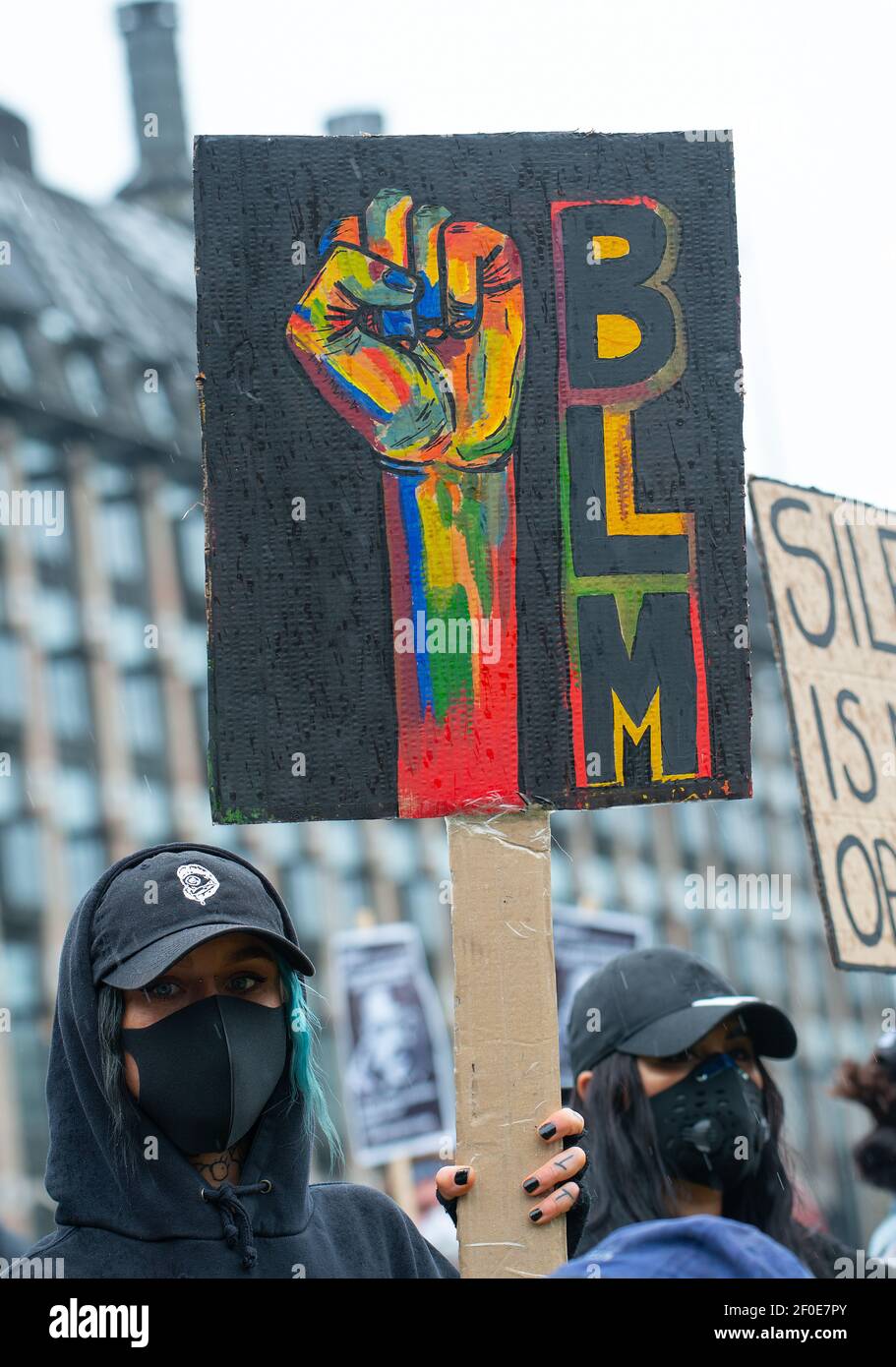 Anti-racism campaigner holding sign, at the Black Lives Matter ...