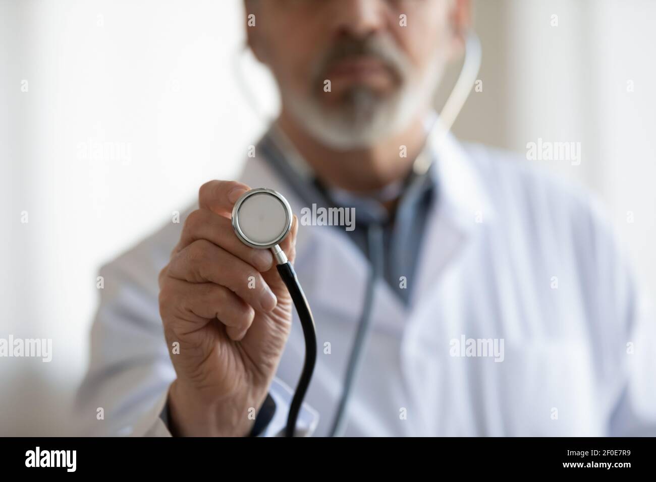 Close up of mature male doctor use stethoscope Stock Photo - Alamy