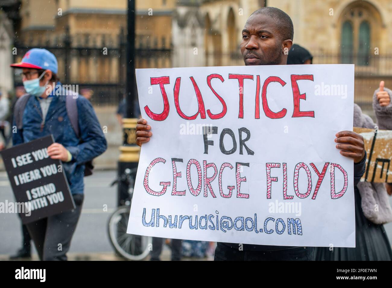 Anti-racism campaigner holding sign, at the Black Lives Matter ...