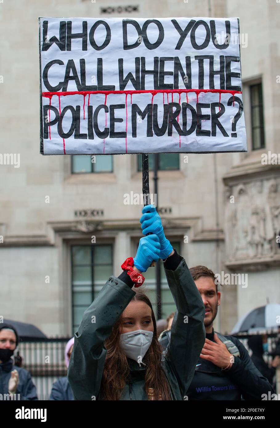Anti-racism campaigner holding sign, at the Black Lives Matter ...
