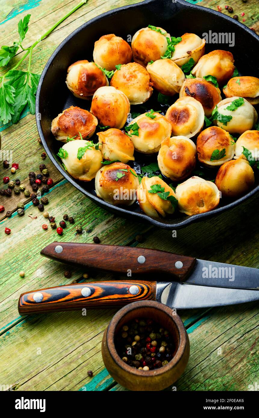 Frying pan with roasted tasty pelmeni.Fried dumplings Stock Photo - Alamy