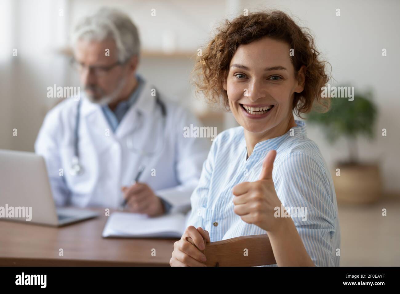 Happy female patient recommend good hospital service Stock Photo - Alamy