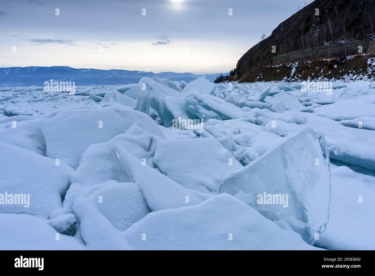 Lake Baikal in Siberia with a pile of beautiful ice hummocks near the ...