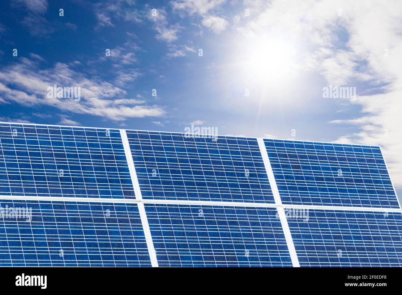 Blue Solar panel over blue sky, sun and clouds. Solar panels pattern ...
