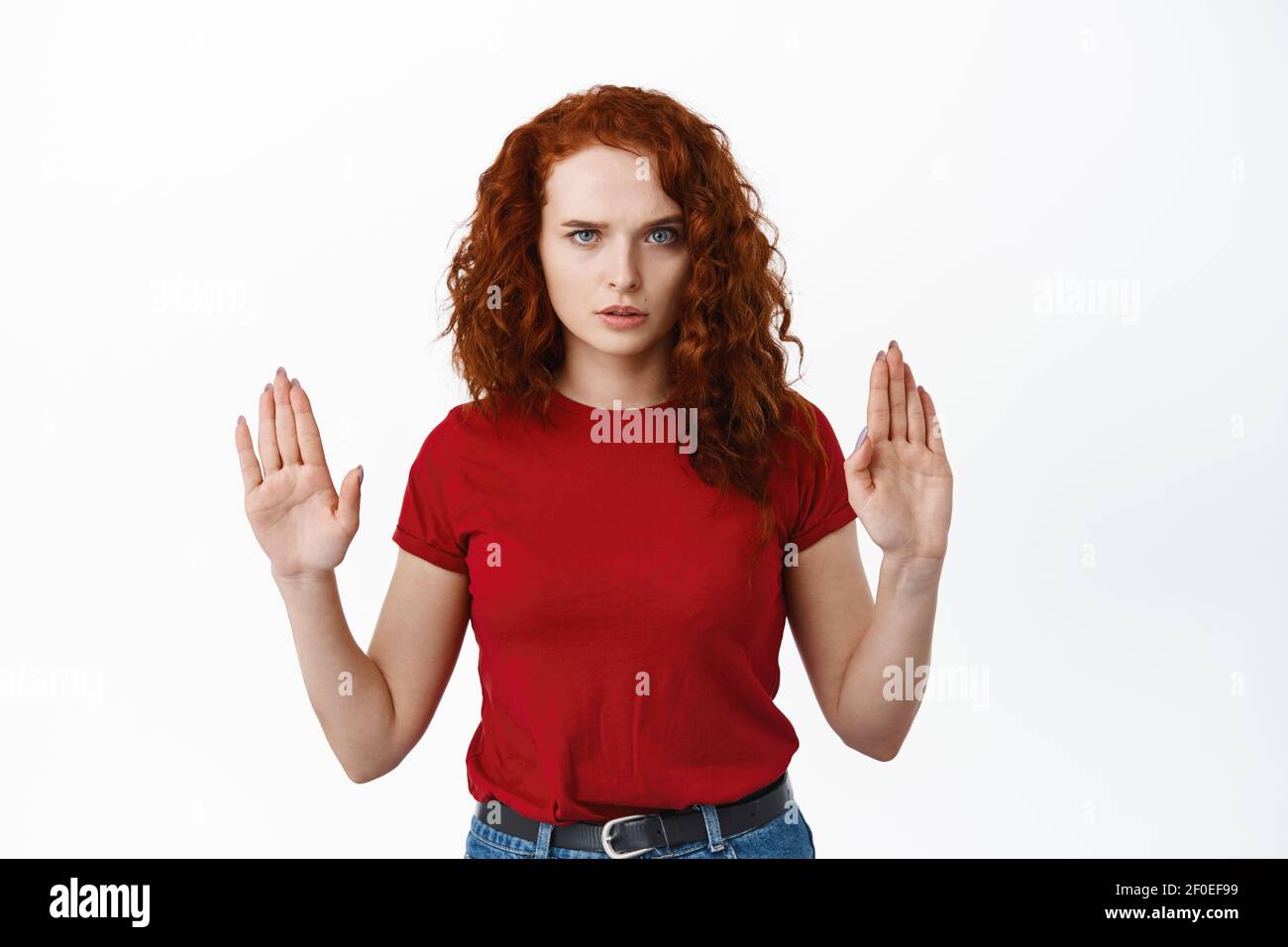 Stop I said no. Serious and confident redhead girl showing block taboo ...