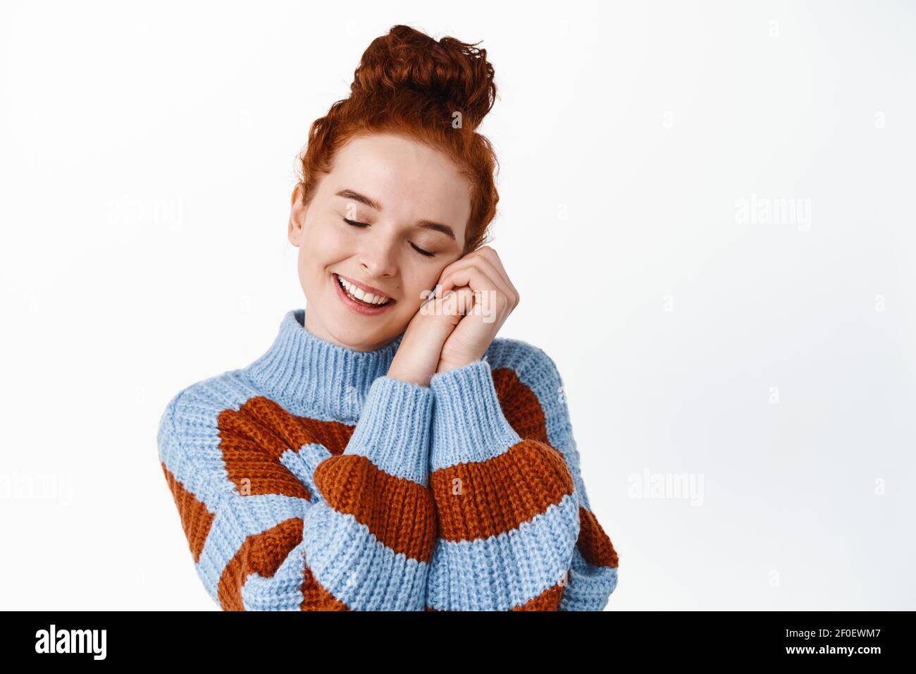 Tender and romantic redhead girl imaging something beautiful, lean face ...