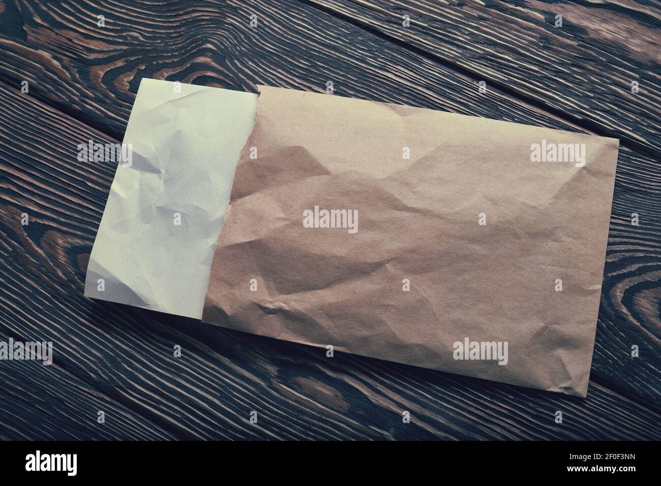 Envelope on table hi-res stock photography and images - Alamy