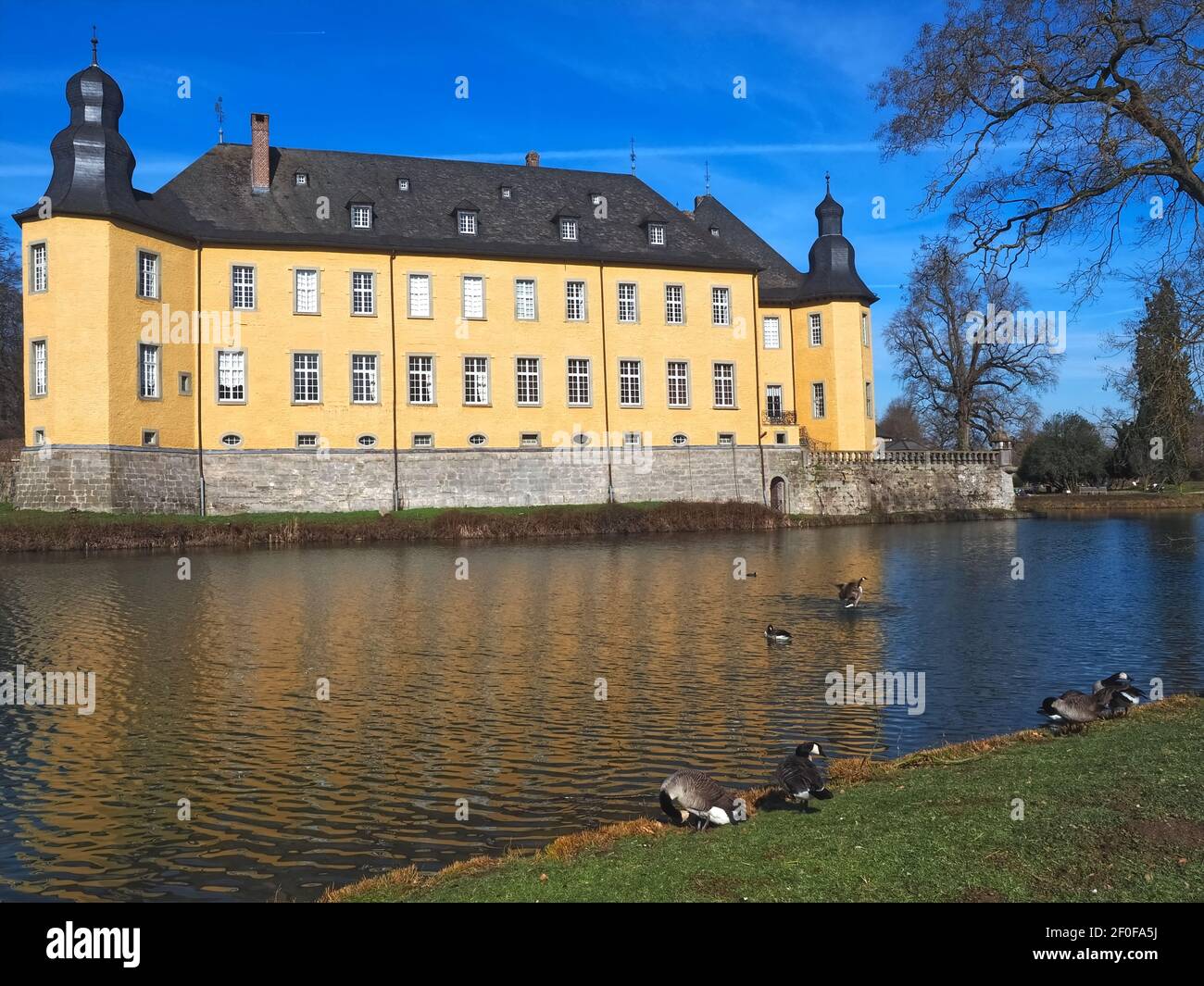 Beautiful german yellow water castle Schloss Dyck Stock Photo - Alamy