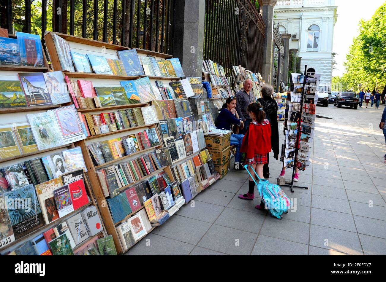 Outdoor Street Side Book Stall With Customers Tbilisi Georgia Stock outdoor-street-side-book-stall-with-customers-tbilisi-georgia-stock