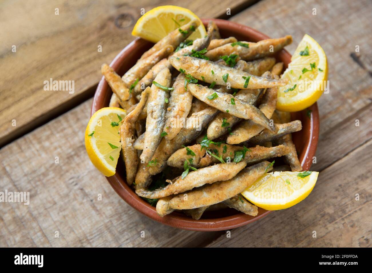Devilled whitebait sprats, Sprattus sprattus, that have been devilled ...