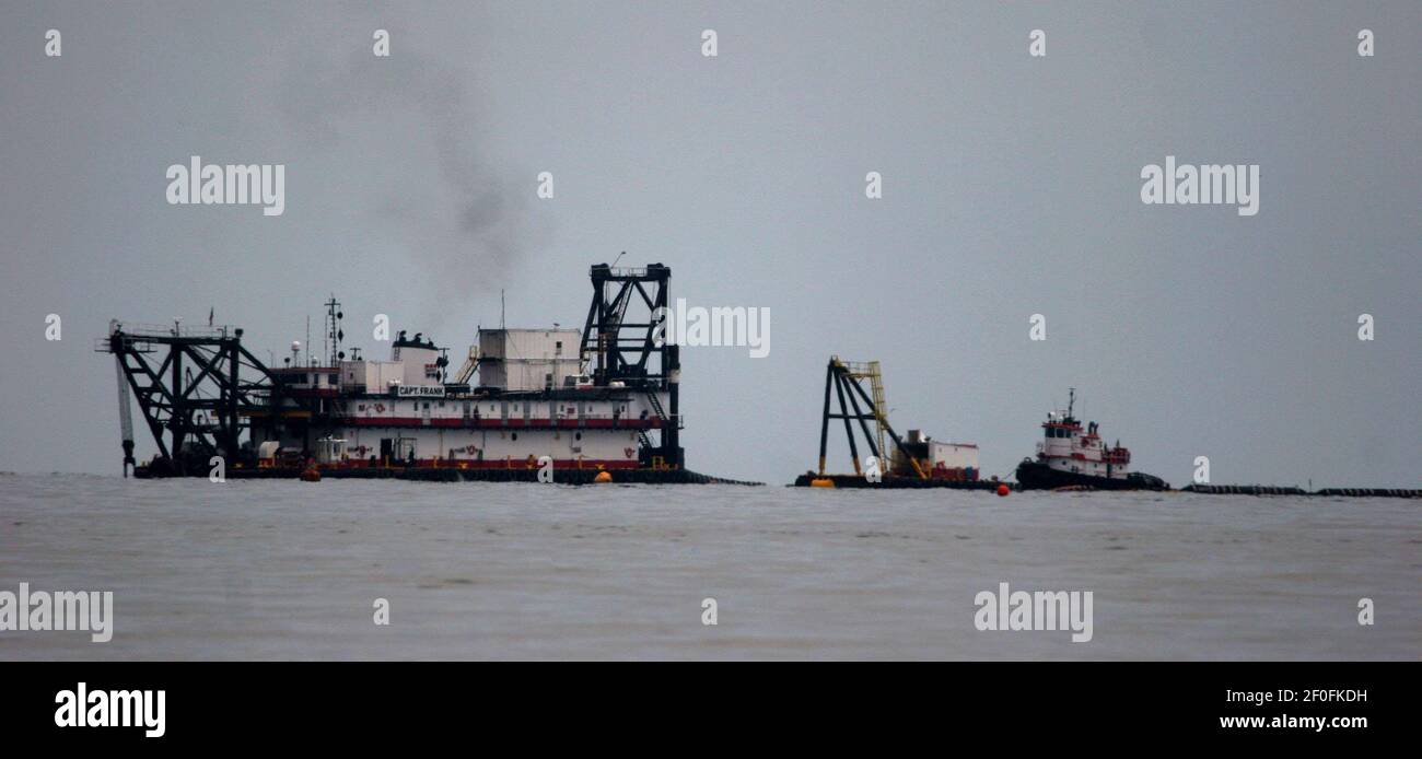 26 May 2010- Barataria Bay, Louisiana- Dredging operations begin just ...