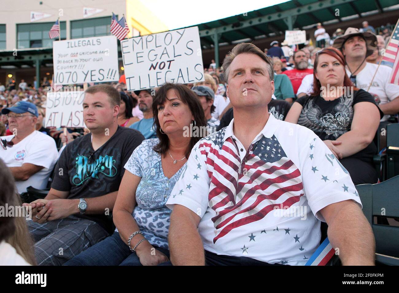 29 May 2010- Tempe, AZ- Lynn and Cindy Harding and son listen to ...