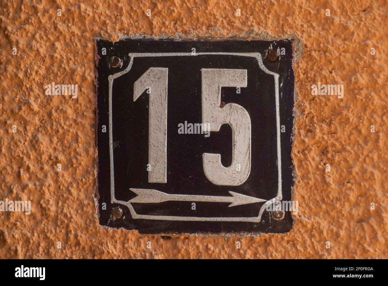Weathered grunge square metal enamelled plate of number of street ...