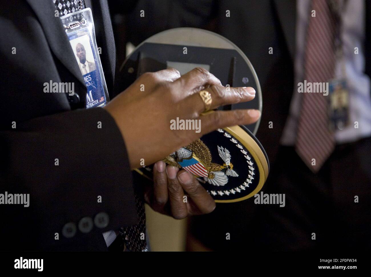 20 July 2010 - Washington, D.C. - A White House Aide holds two ...