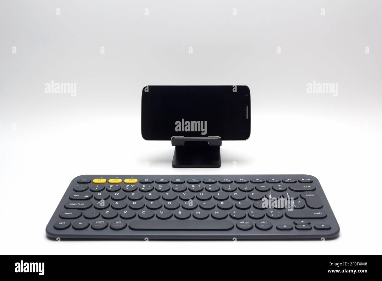 Mobile phone and wireless keyboard Stock Photo - Alamy