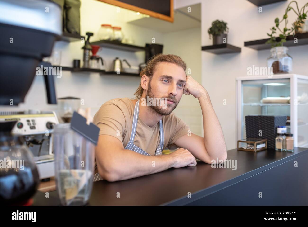 Man behind bar counter hi-res stock photography and images - Alamy