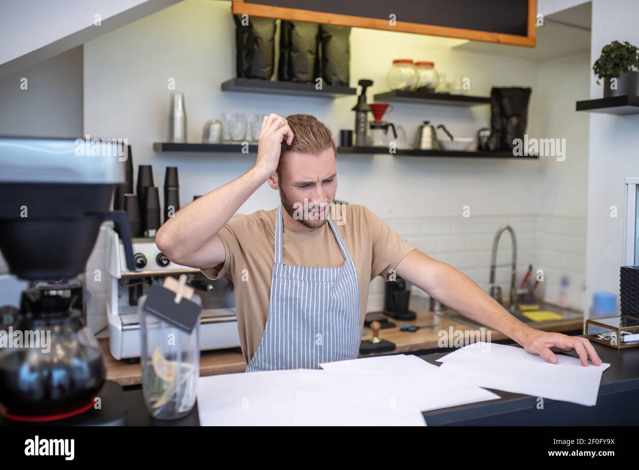 Man behind bar counter hi-res stock photography and images - Alamy