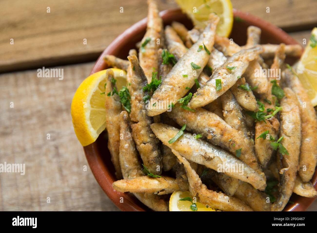 Devilled whitebait sprats, Sprattus sprattus, that have been devilled ...