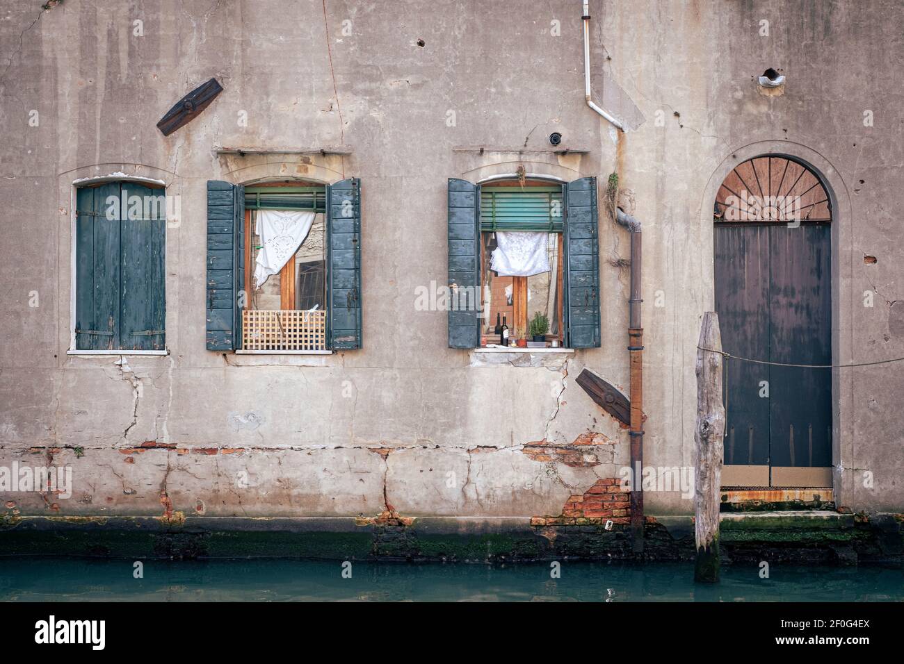 Venice, Italy. The crumbling facade of a canal side building Stock ...