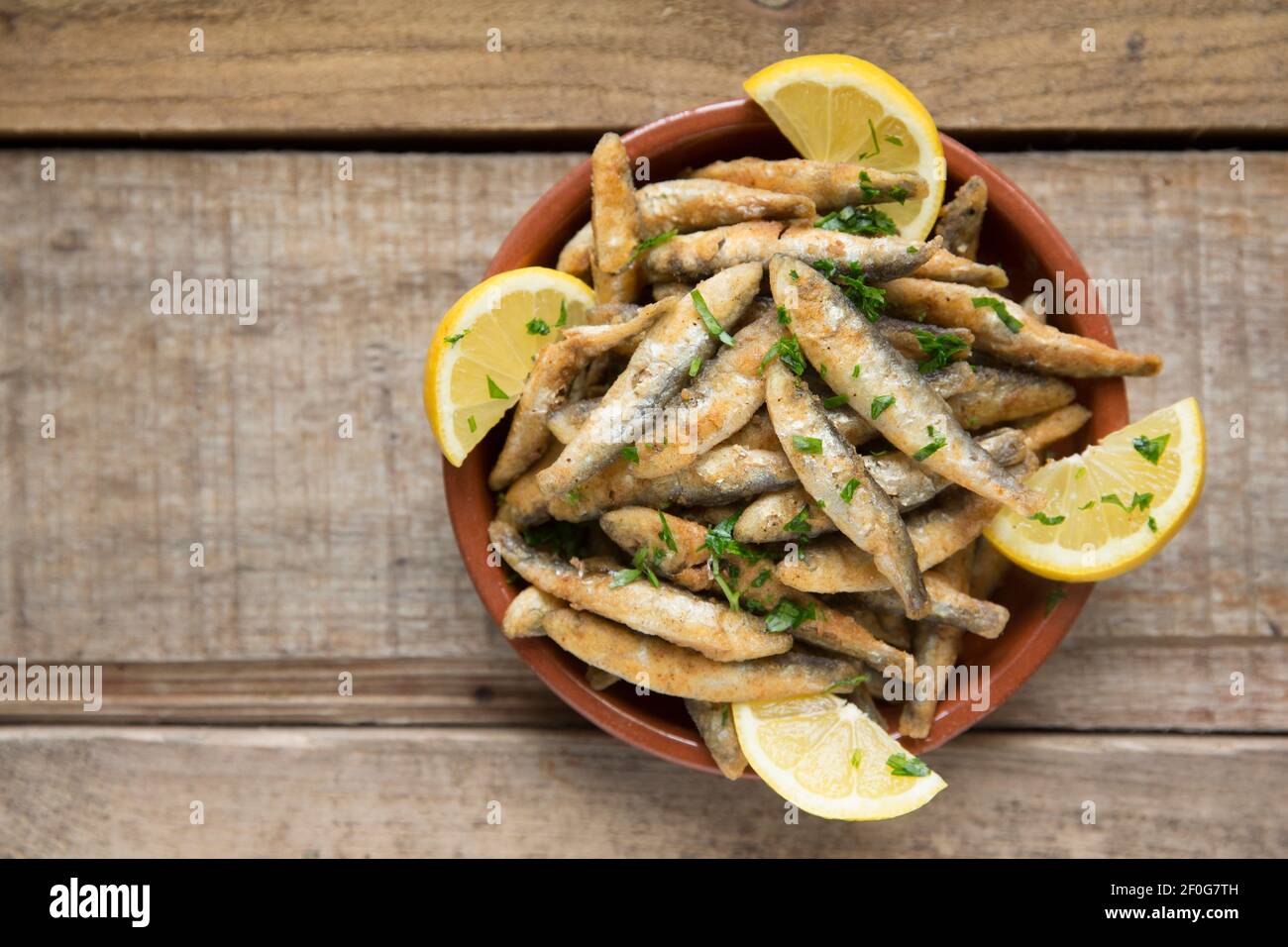 Devilled whitebait sprats, Sprattus sprattus, that have been devilled ...