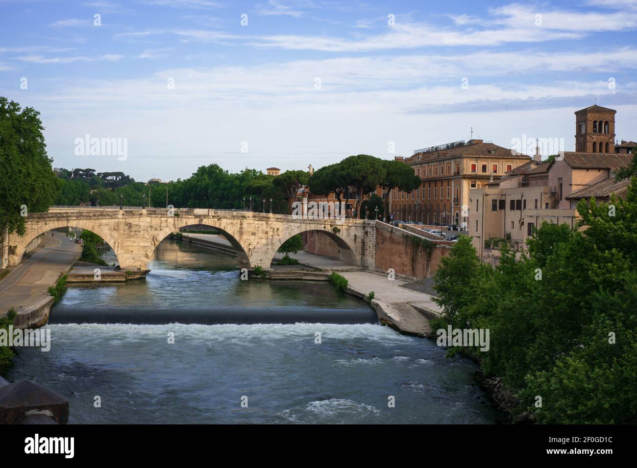 Ponte Cestio in stone with three arches, the Tiberina island, the ...