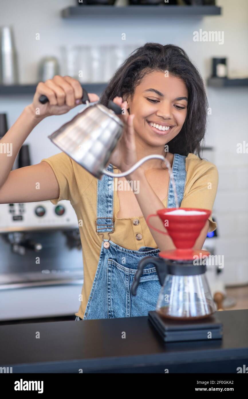 Young woman brewing coffee in hi-res stock photography and images - Alamy