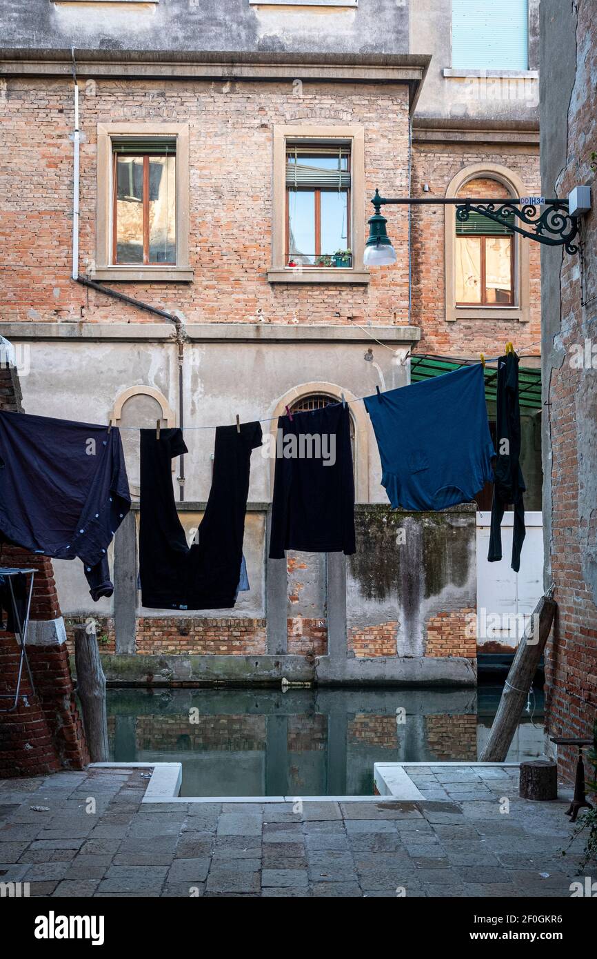 Venice, Italy. The crumbling facades of Venice, with laundry hanging ...