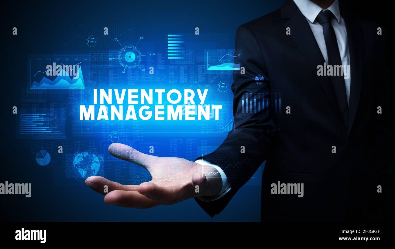 Hand of Businessman holding INVENTORY MANAGEMENT inscription, business ...