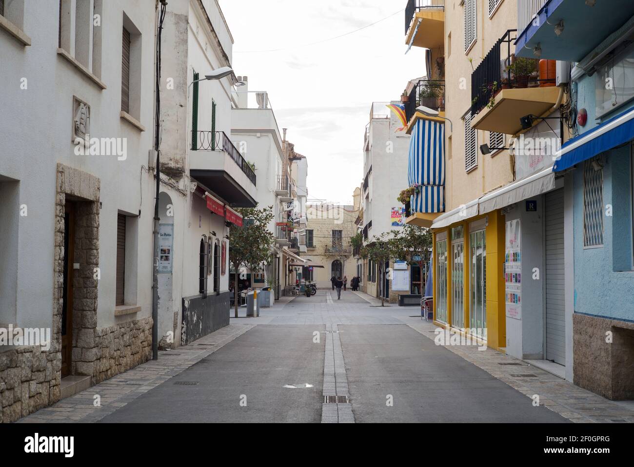 Stores, apartments and a beautiful alley in Sitges Spain Stock Photo ...