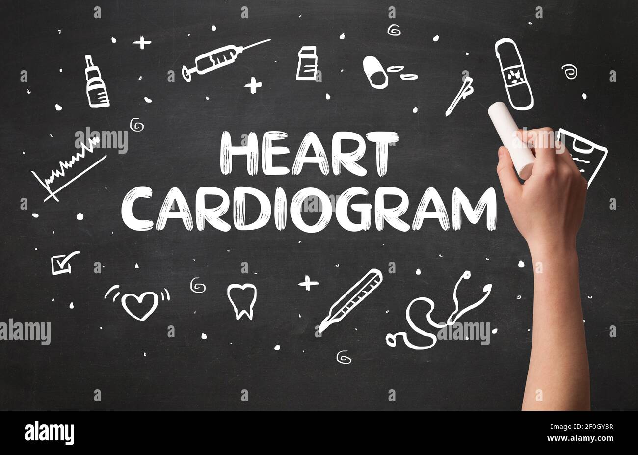 Hand drawing HEART CARDIOGRAM inscription with white chalk on ...