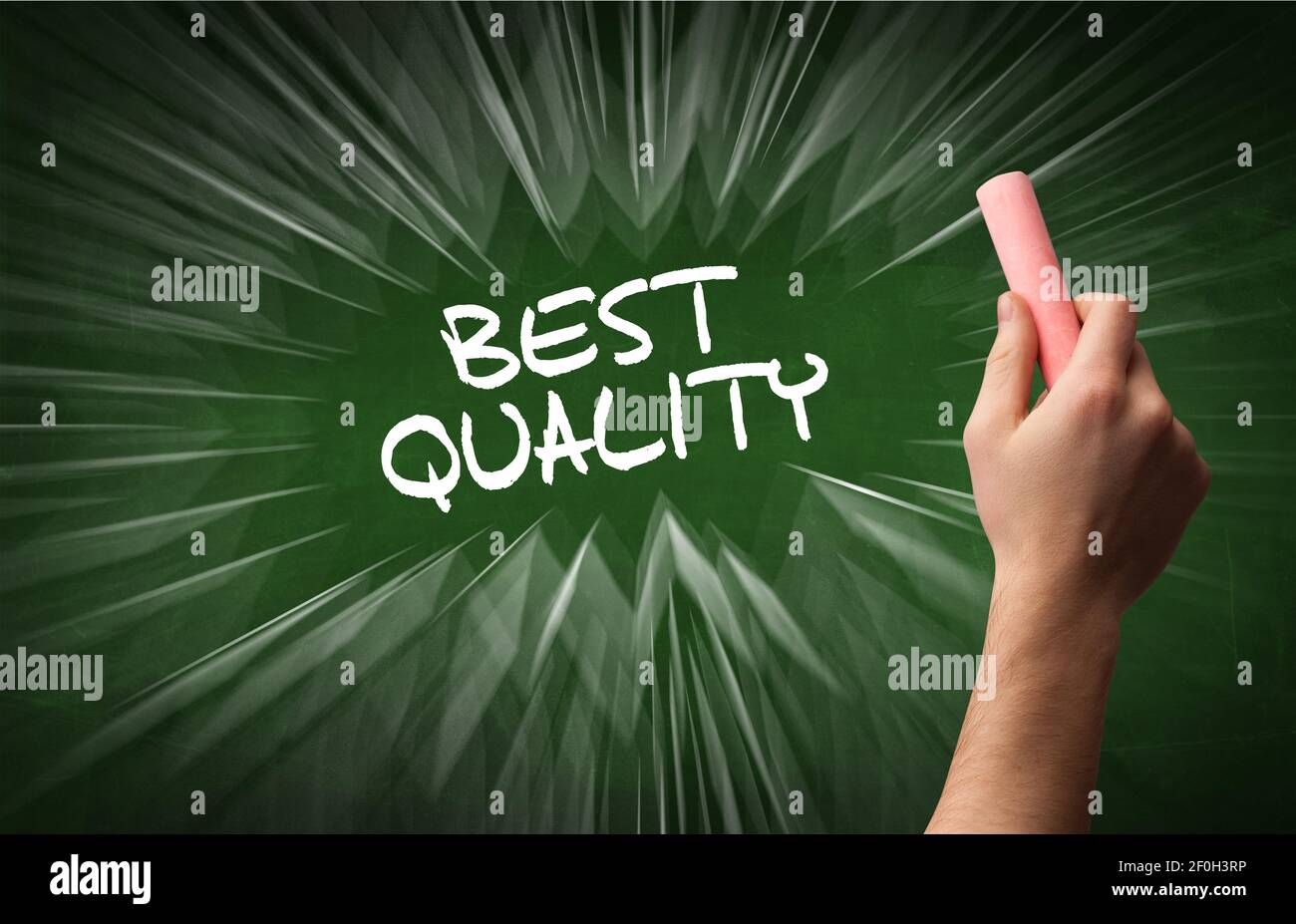 Hand drawing BEST QUALITY inscription with white chalk on blackboard ...