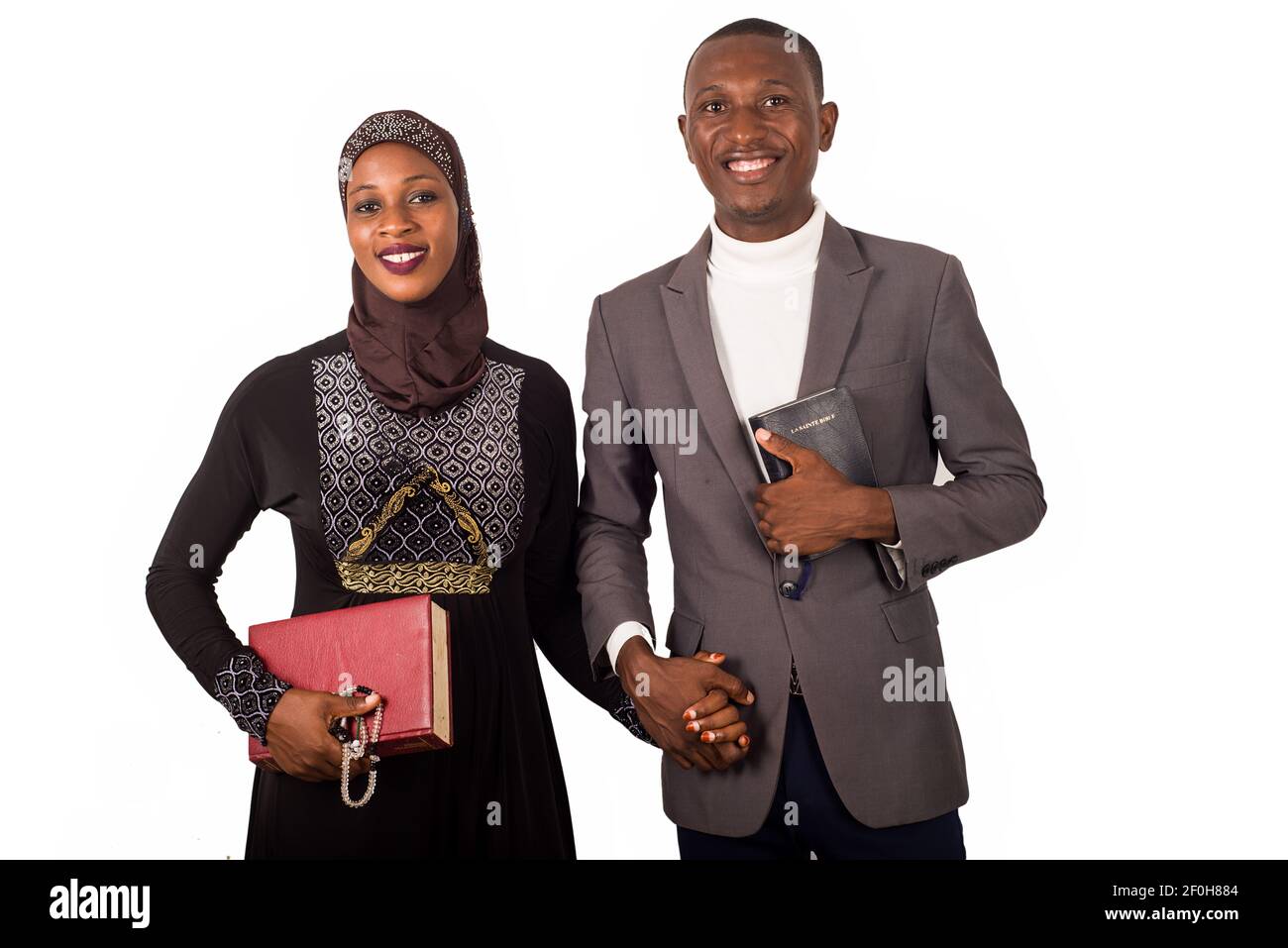 portraits of two religious people holding hands, smiling and holding ...