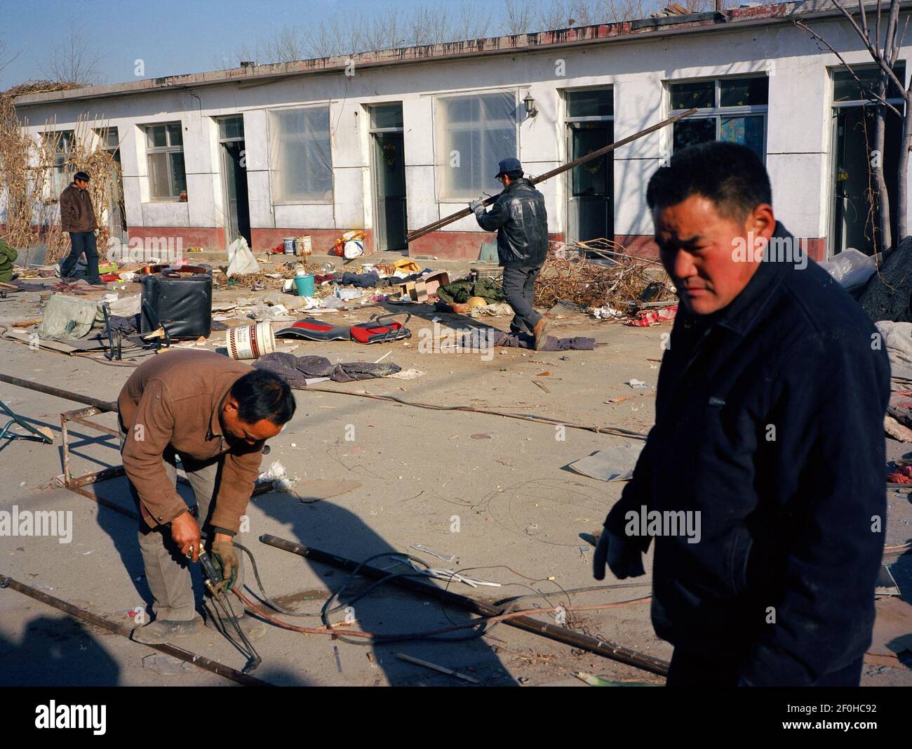 Chinese workers. (Photo by Raphael Fournier/Sipa USA Stock Photo - Alamy