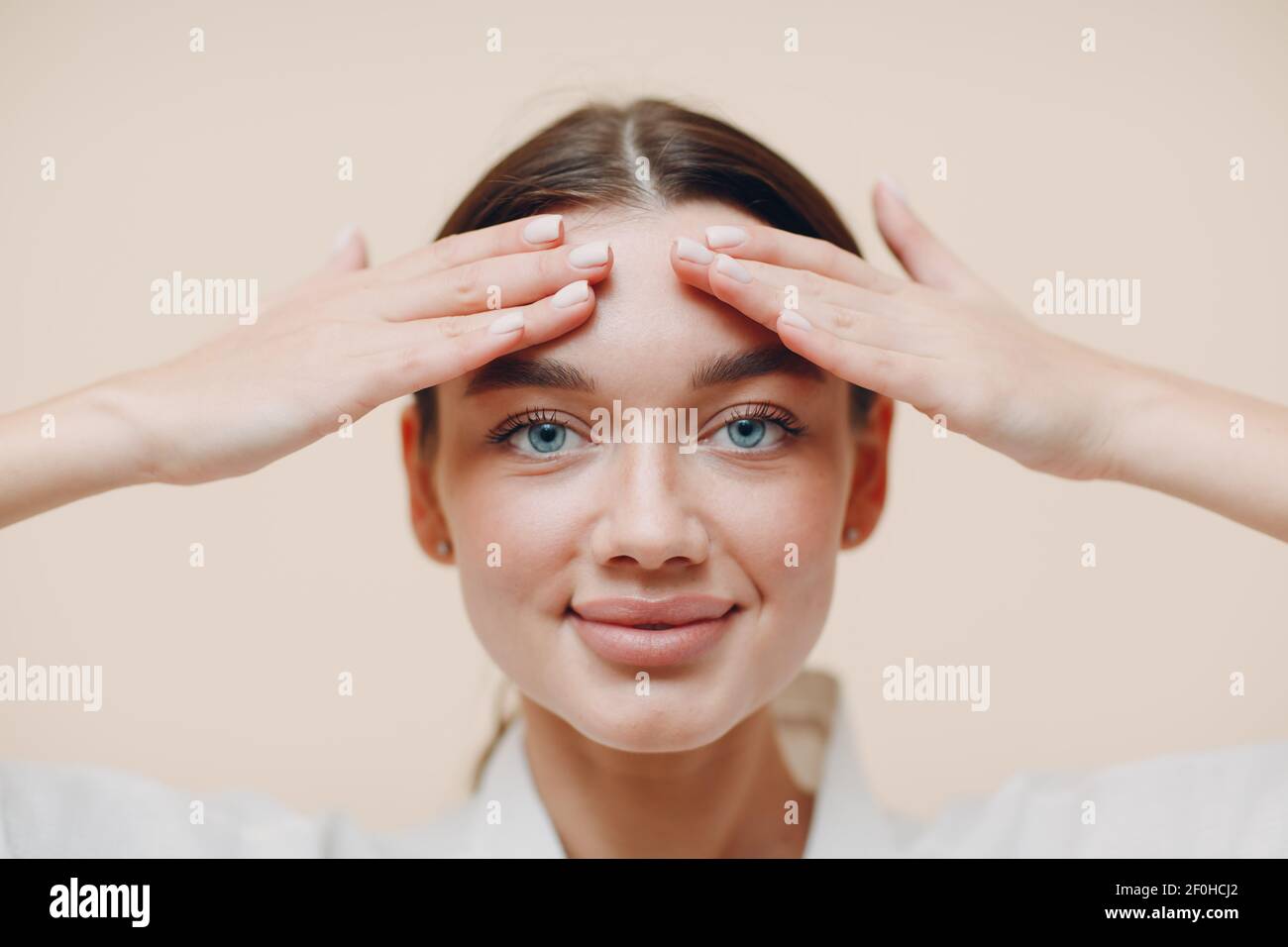 Young woman doing face building facial gymnastics self massage Stock ...