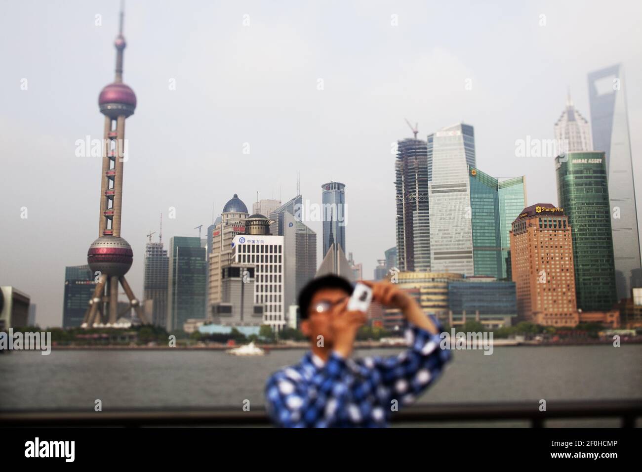 Daily life in Shanghai with the skyline of Shanghai. (Photo by Robin ...