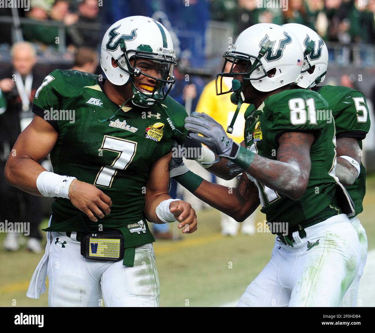 South Florida quarterback B.J. Daniels (7) is congratulated by ...
