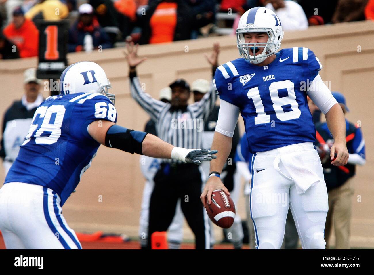 Duke quarterback Brandon Connette (18) reacts with teammate Brian Moore ...