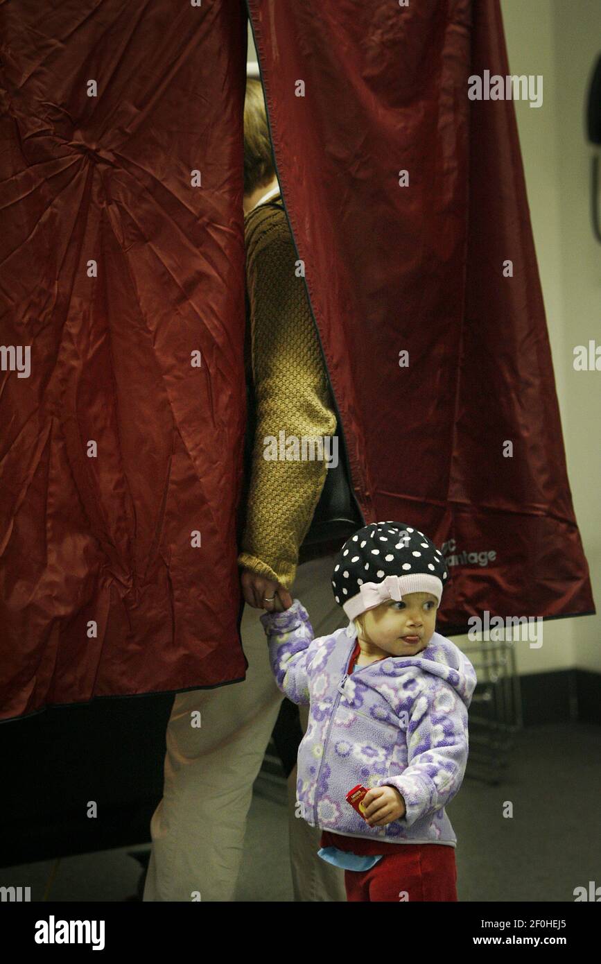 Adel Dunkleberger, 1, waits patiently as her mother, Elena Dunkleberger ...