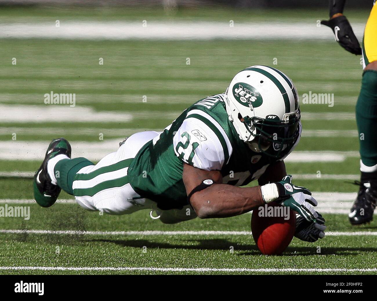 New York Jets running back LaDaninan Tomlinson dives on the ball after ...