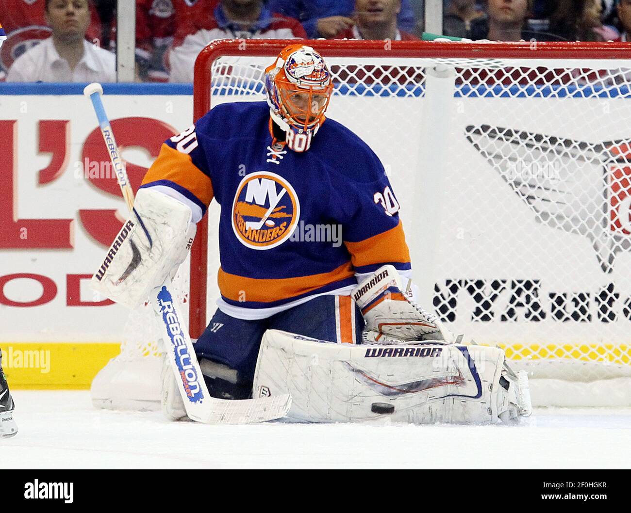 New York Islanders goalie Dwayne Roloson makes a save against the ...