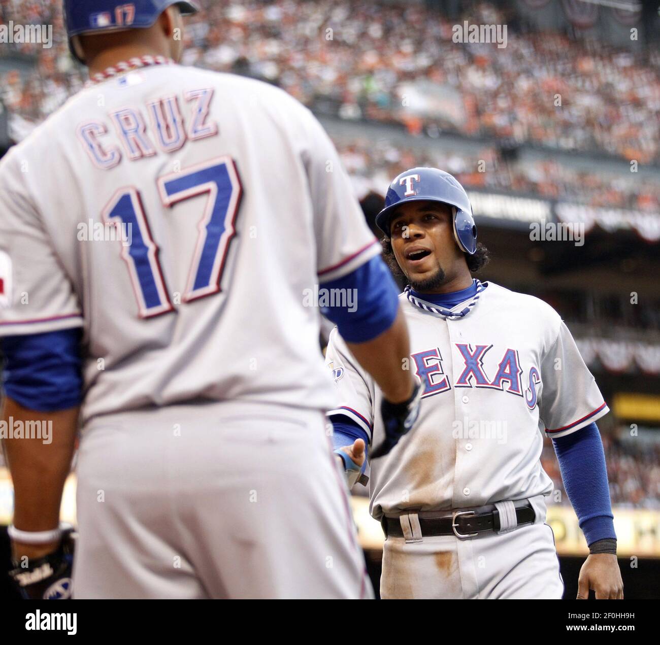 Texas Rangers' Nelson Cruz congratulates Elvis Andrus, who scored in ...