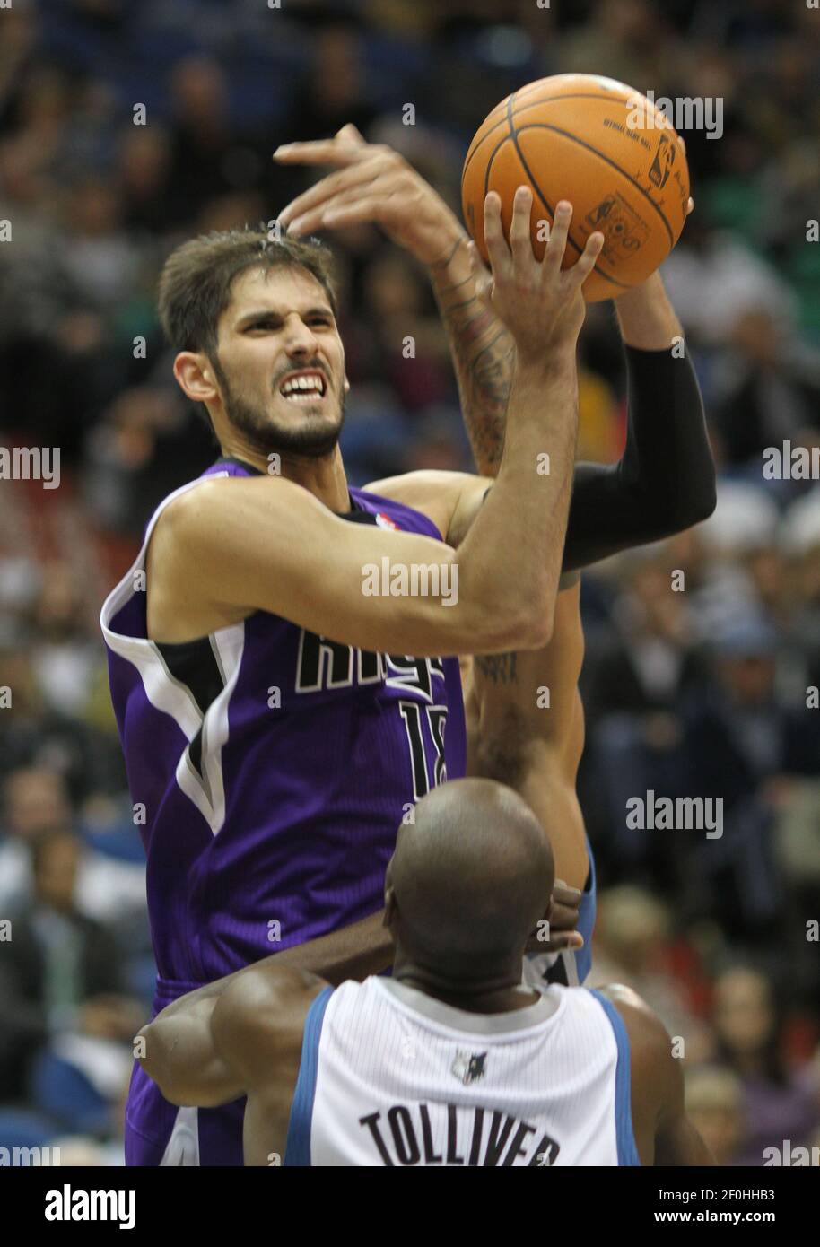 Sacramento Kings' Omri Casspi, left, puts up a shot over the defense of ...